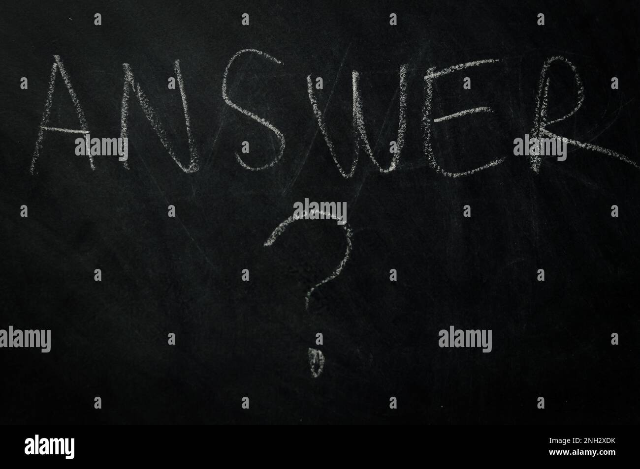 answer ? - the word answer handwritten with chalk on a blackboard with ...