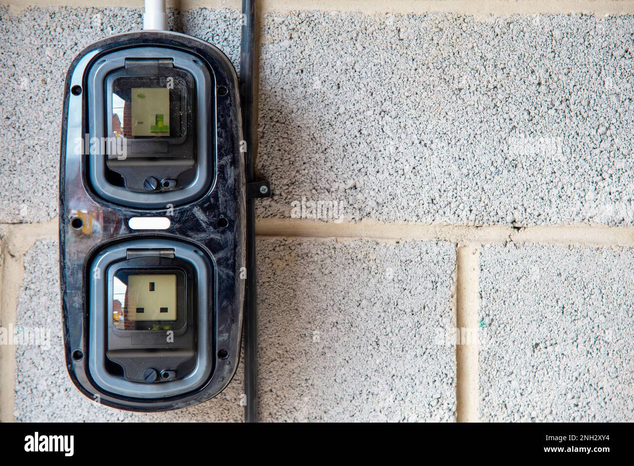 Electric vehicle domestic charging point installed outside of the house ...