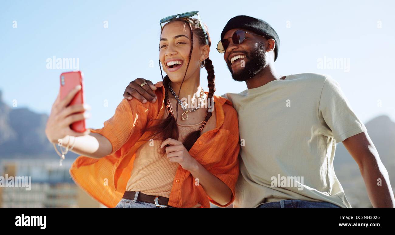 Couple, bonding and phone selfie on city building rooftop on New York ...