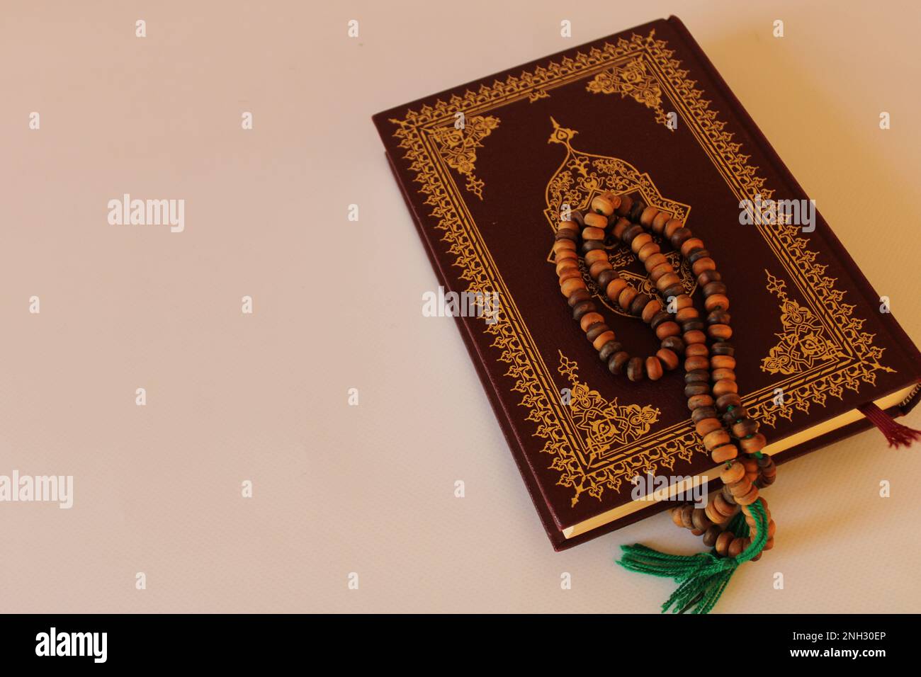 Islamic concept on background. Dark brown prayer rosary beads and holy ...