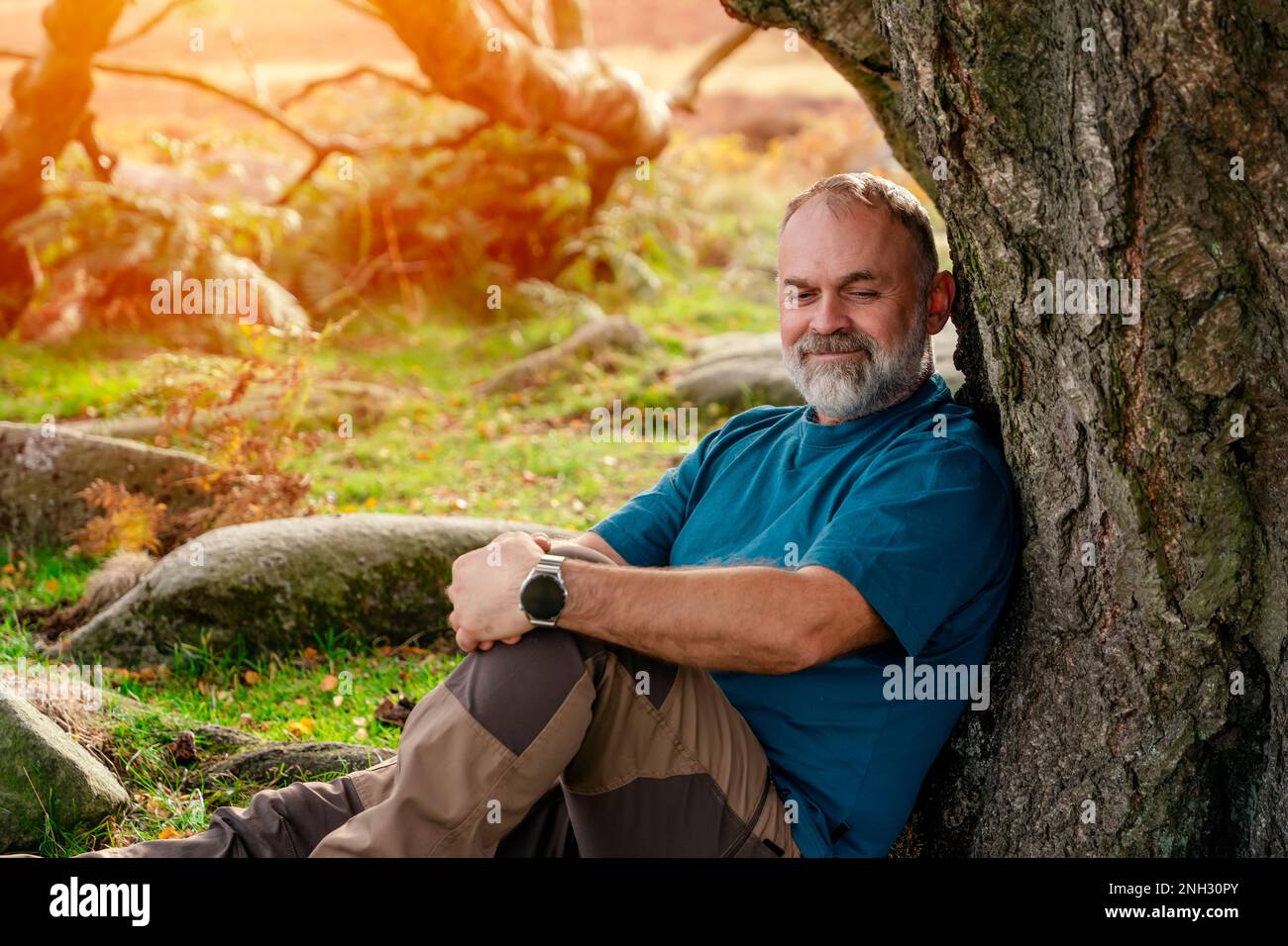 Man resting under tree hi-res stock photography and images - Alamy
