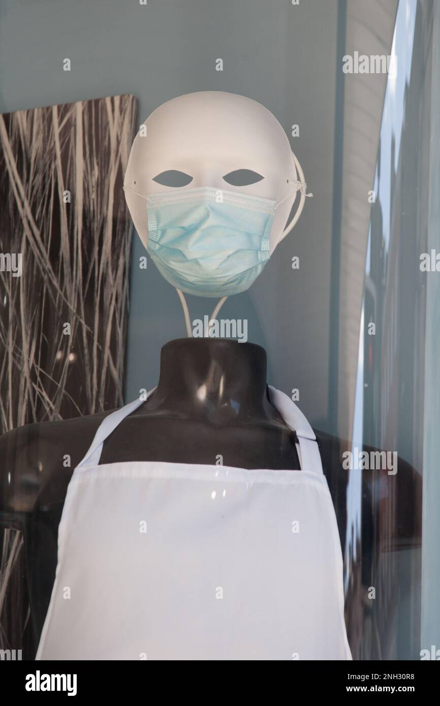 A mask on a manikin in a barbers in Dorchester, Dorset in the UK, taken ...