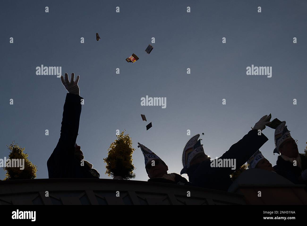 Mainz, Germany. 20th Feb, 2023. Participants throw candy from a float ...