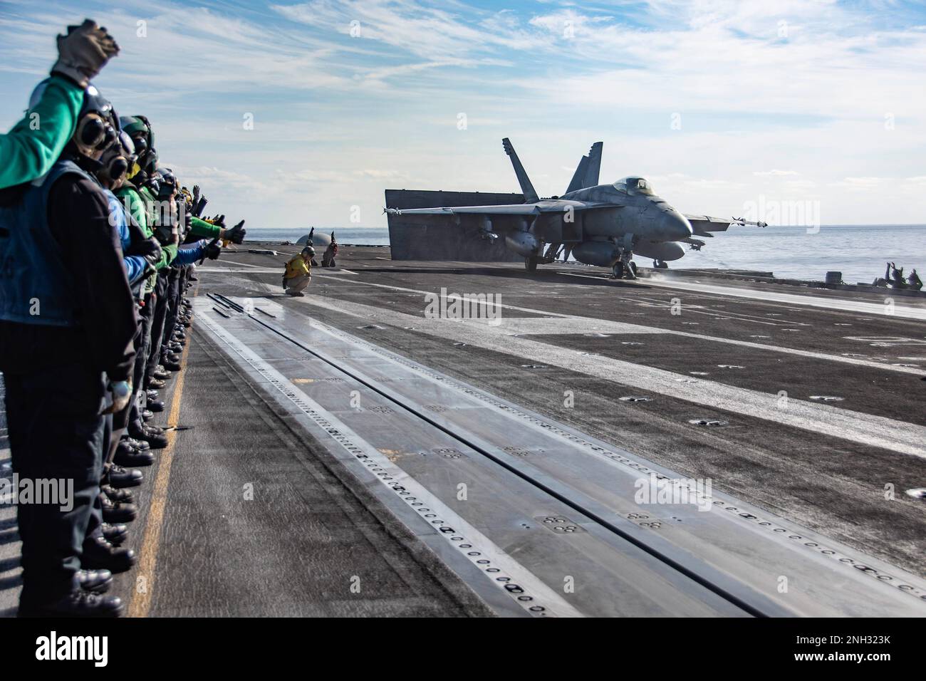 221209-N-WU964-2111 PHILIPPINE SEA (Dec. 9, 2022) Sailors observe as an ...