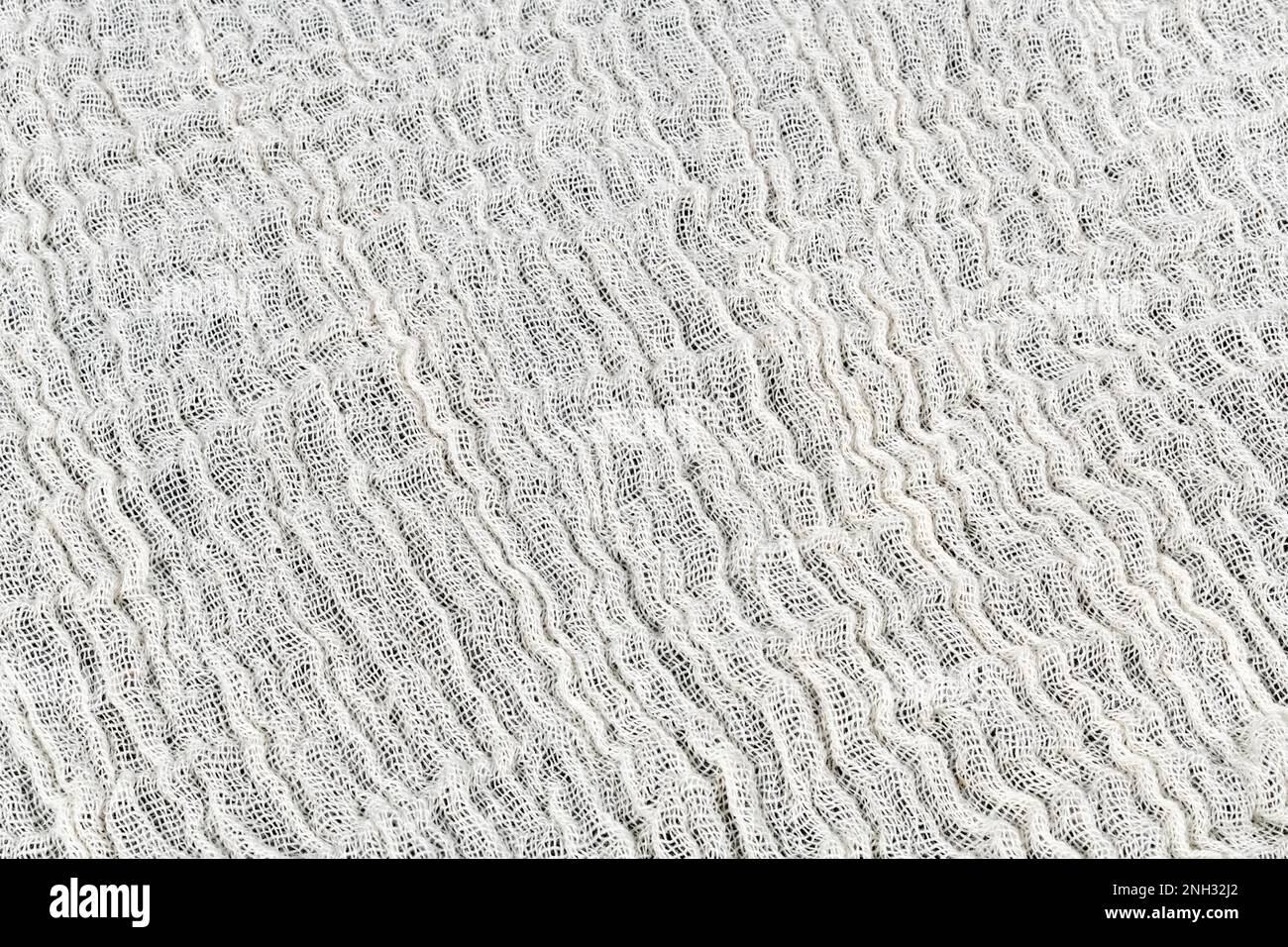 Close shot of cotton cheesecloth material - fabric washed & dried but ...