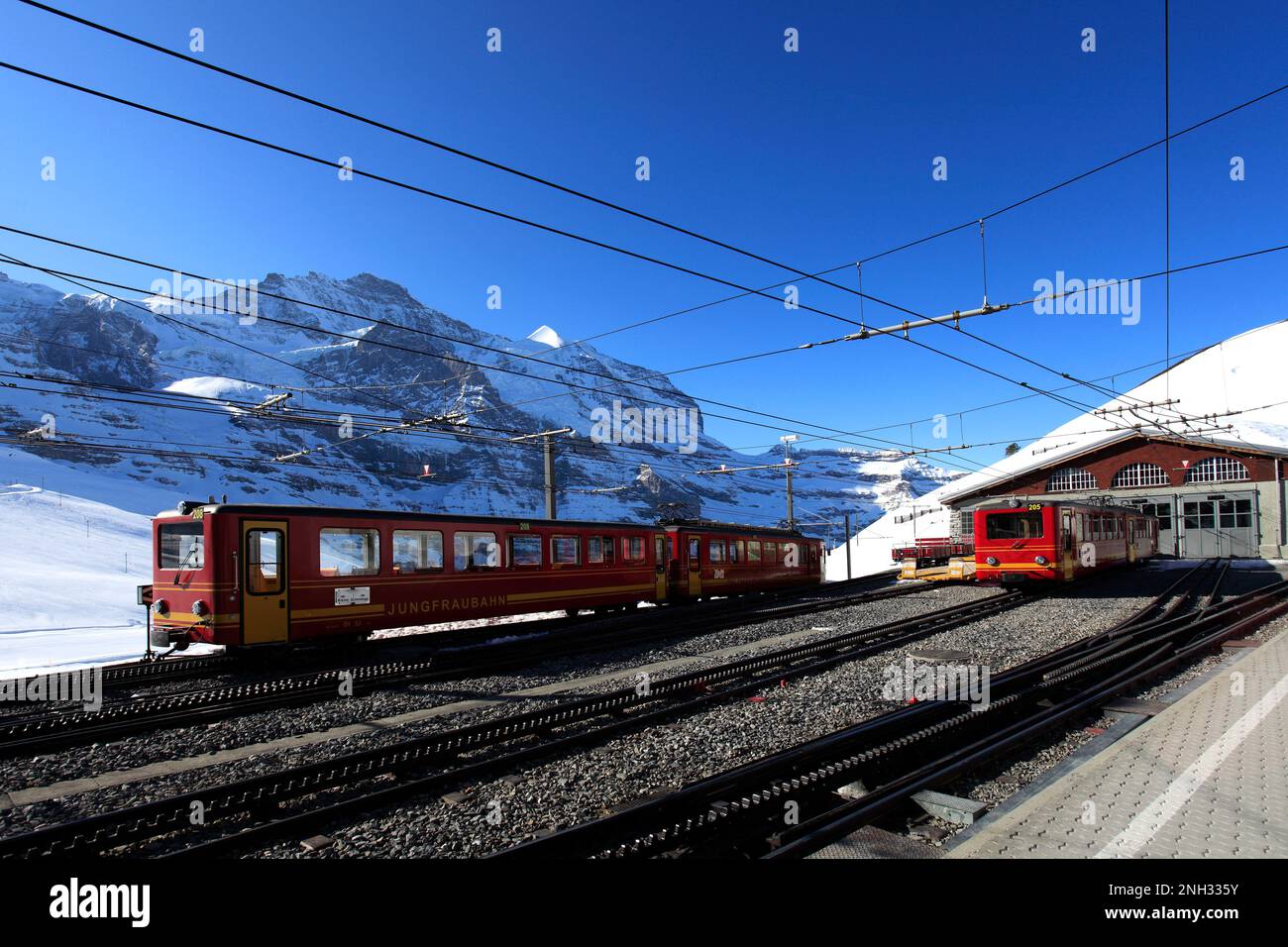 Jungfraubahn trains in the station at the ski resort of Kleine ...