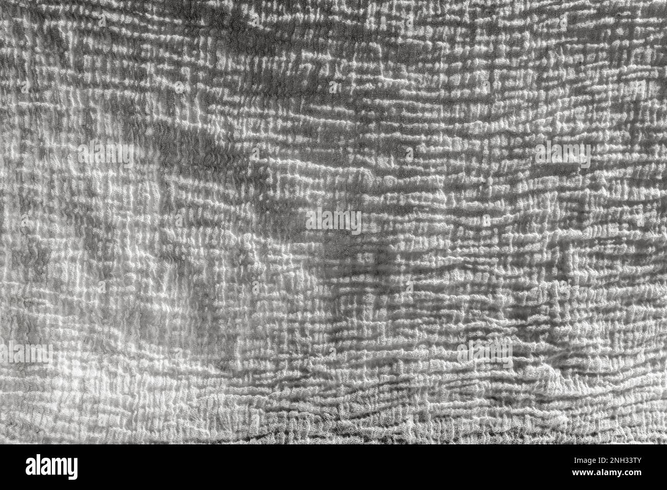 Close shot of cotton cheesecloth material - fabric washed & dried but ...