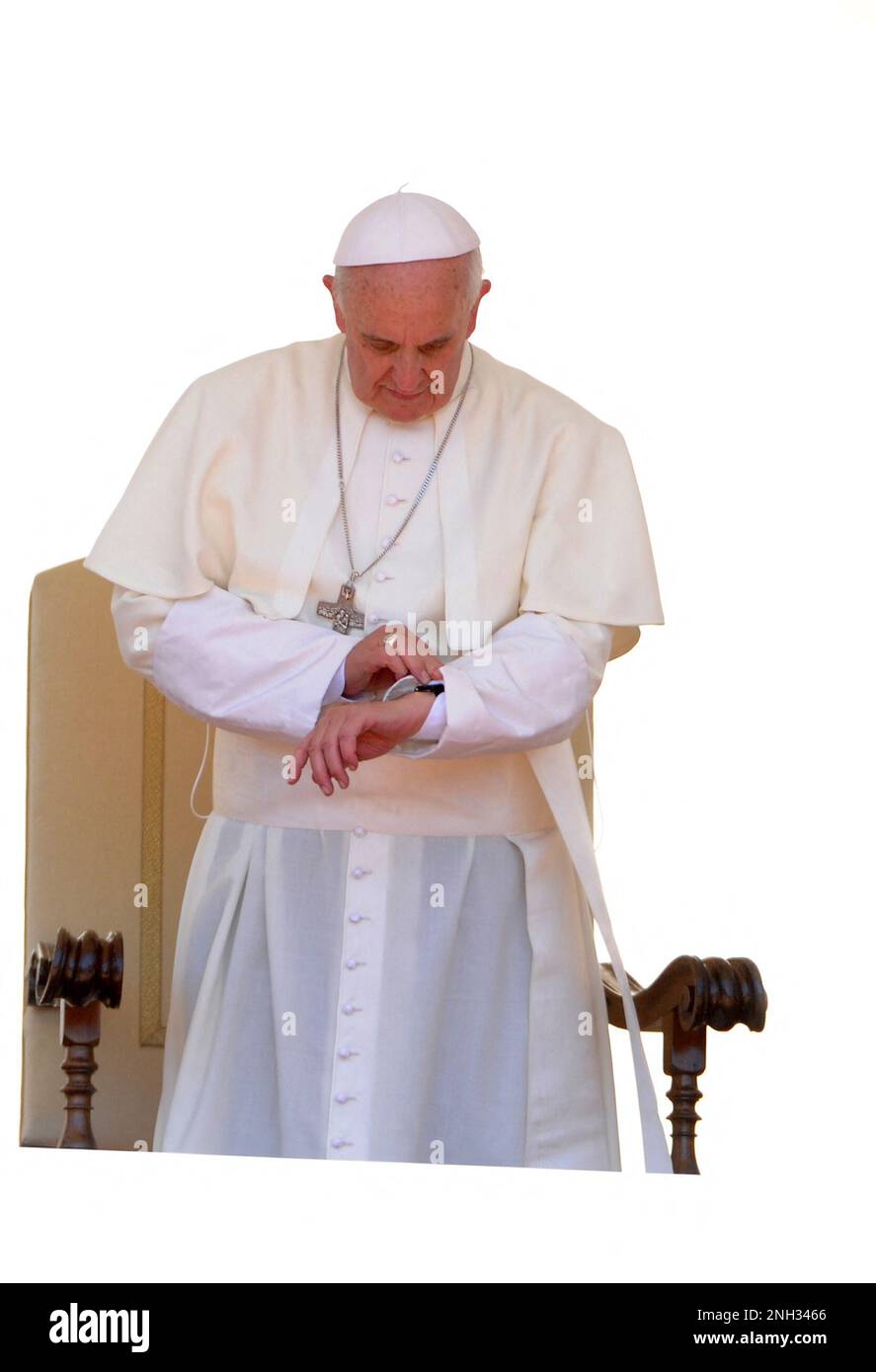 Pope Francis looks at his watch during the weekly general audience in ...
