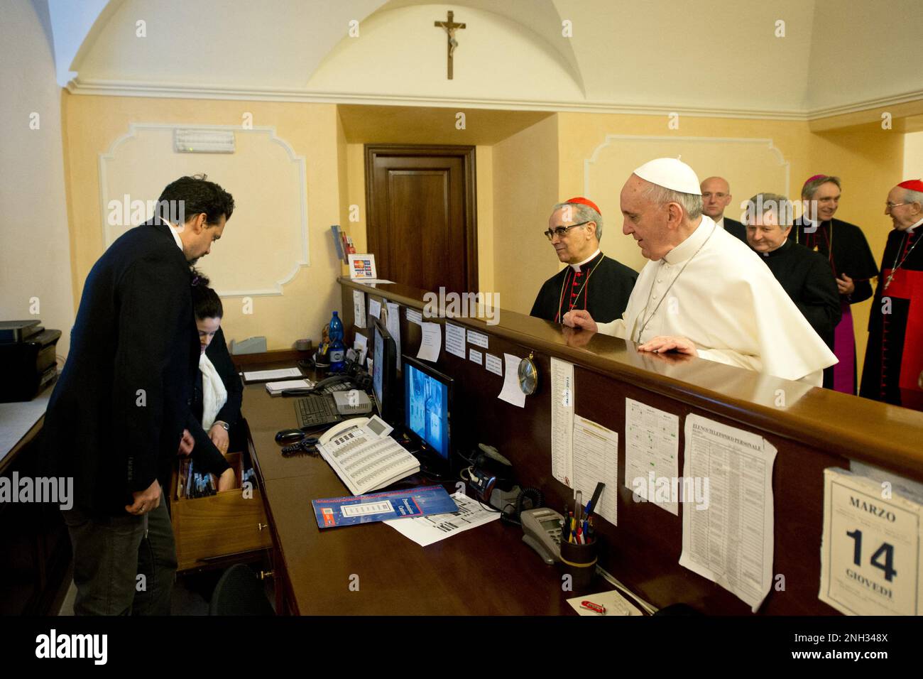 Pope Francis at the reception desk of the Domus Internationalis Paulus ...