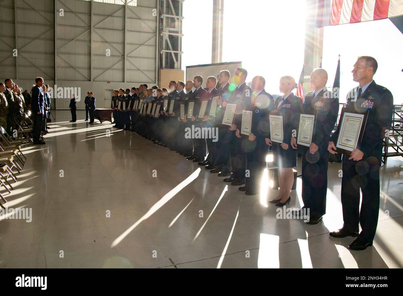 U.S. Airmen and recipients of the Distinguished Flying Cross hold a ...