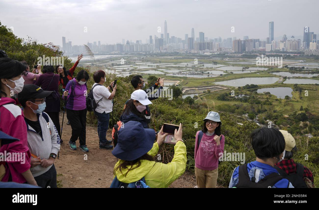 People hiking in Ma Tso Lung at Lok Ma Chau. The background is the view ...