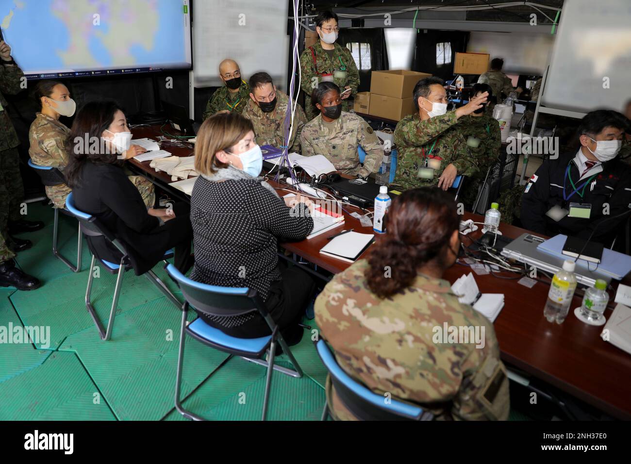 U. S. Army Judge Advocate General (JAG) Officers attend a briefing with ...