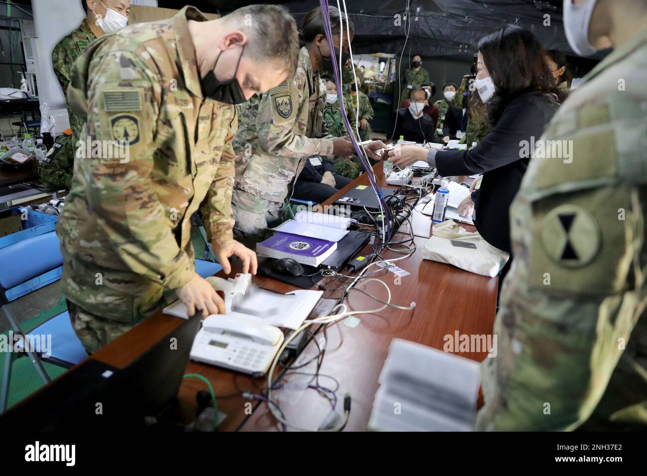 U. S. Army Judge Advocate General (JAG) Officers attend a briefing with ...