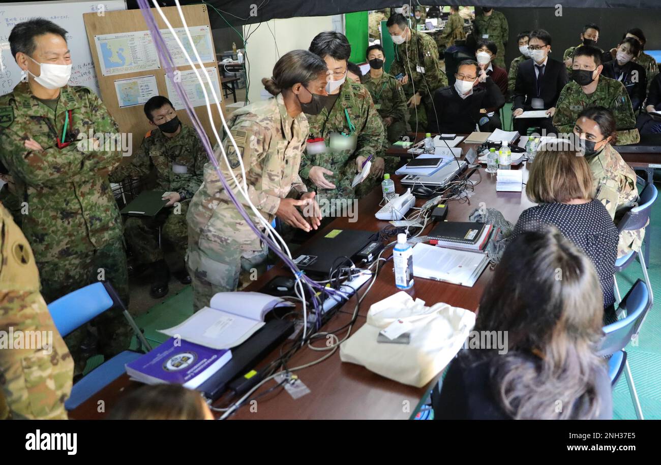 U. S. Army Judge Advocate General (JAG) Officers attend a briefing with ...
