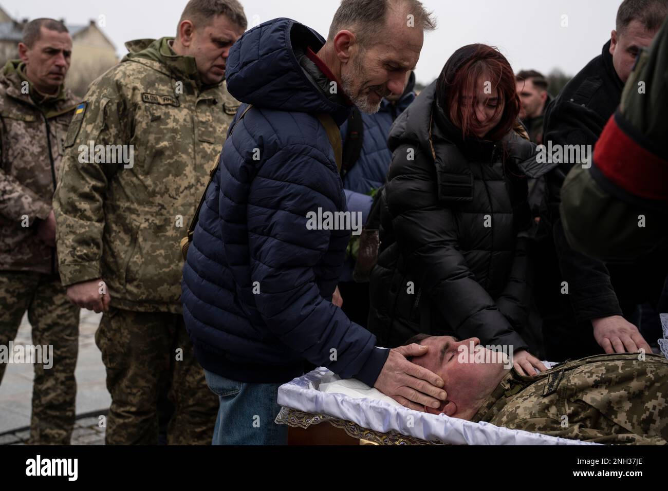 Family members stand with military serviceman Ruslan Zastavnyi during ...