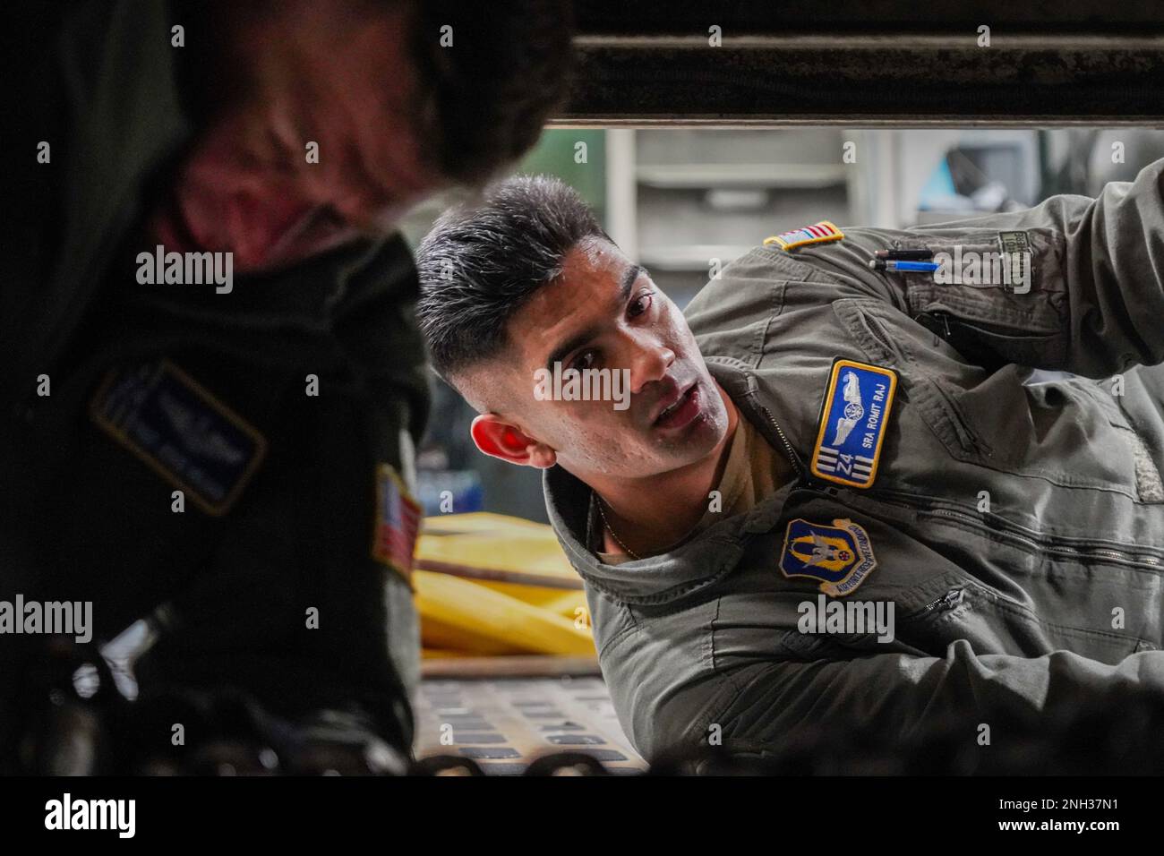 Senior Airman Romit Raj (right), a loadmaster from the 301st Airlift ...