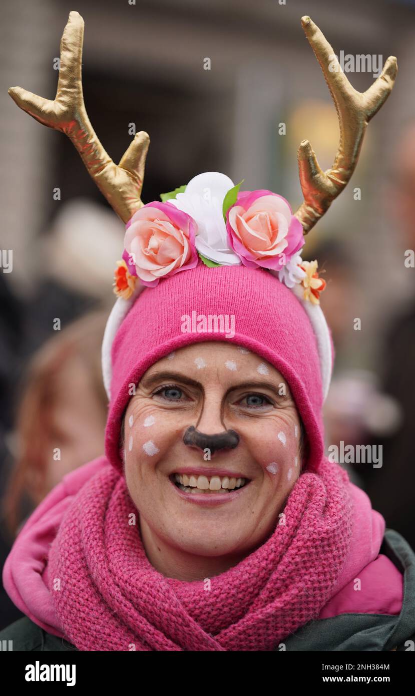 Marne, Germany. 20th Feb, 2023. A dressed-up passerby follows the Rose ...