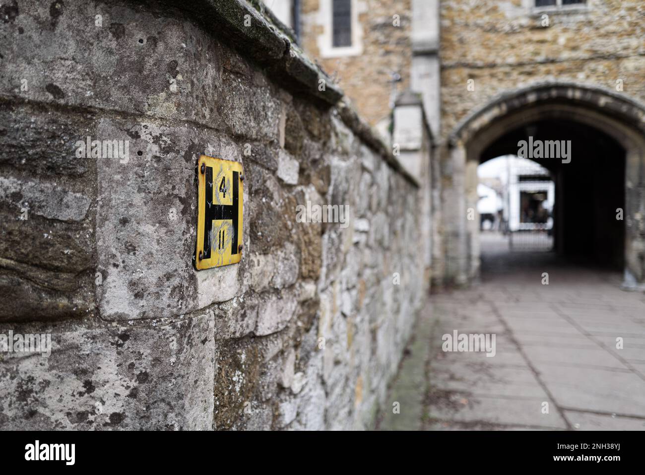 Shallow focus of a typical Hydrant yellow sign seen attached to a ...