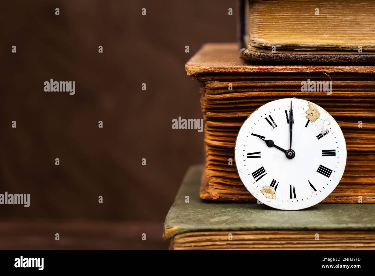 Old antique books and vintage clock face with copy space. Story time ...