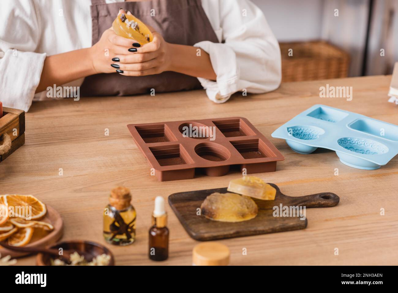 partial view of african american woman holding herbal soap near ...