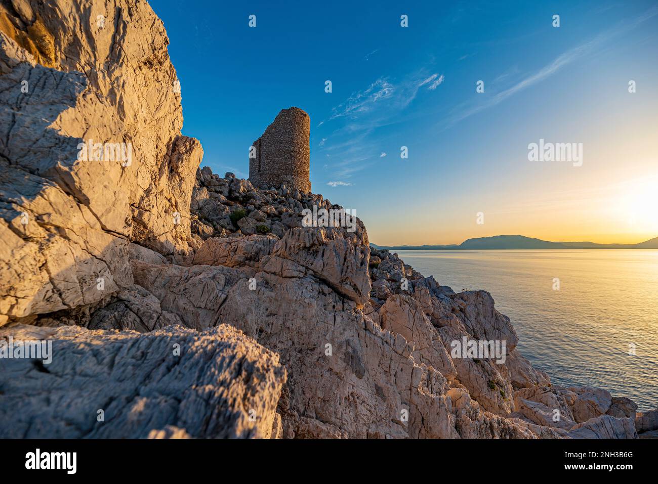 The ancient coastal tower of Capo Rama at dusk, Sicily Stock Photo - Alamy