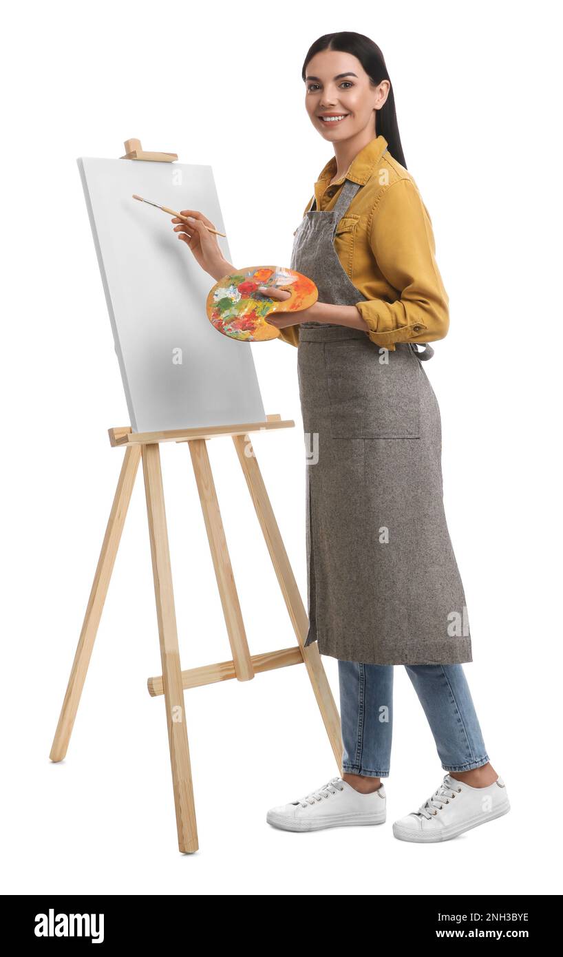 Young woman drawing on easel against white background Stock Photo - Alamy