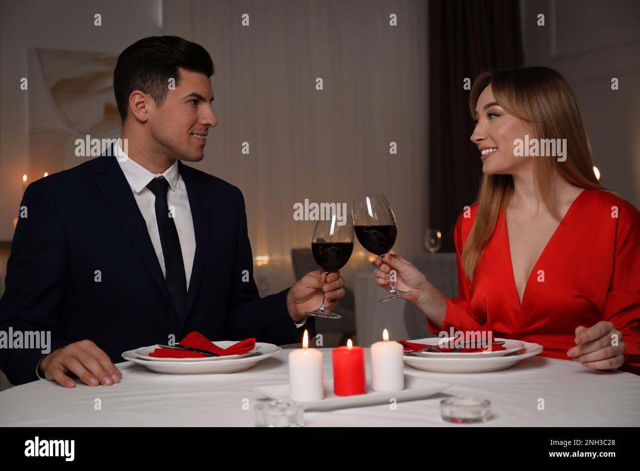 Lovely couple having romantic dinner in restaurant Stock Photo - Alamy