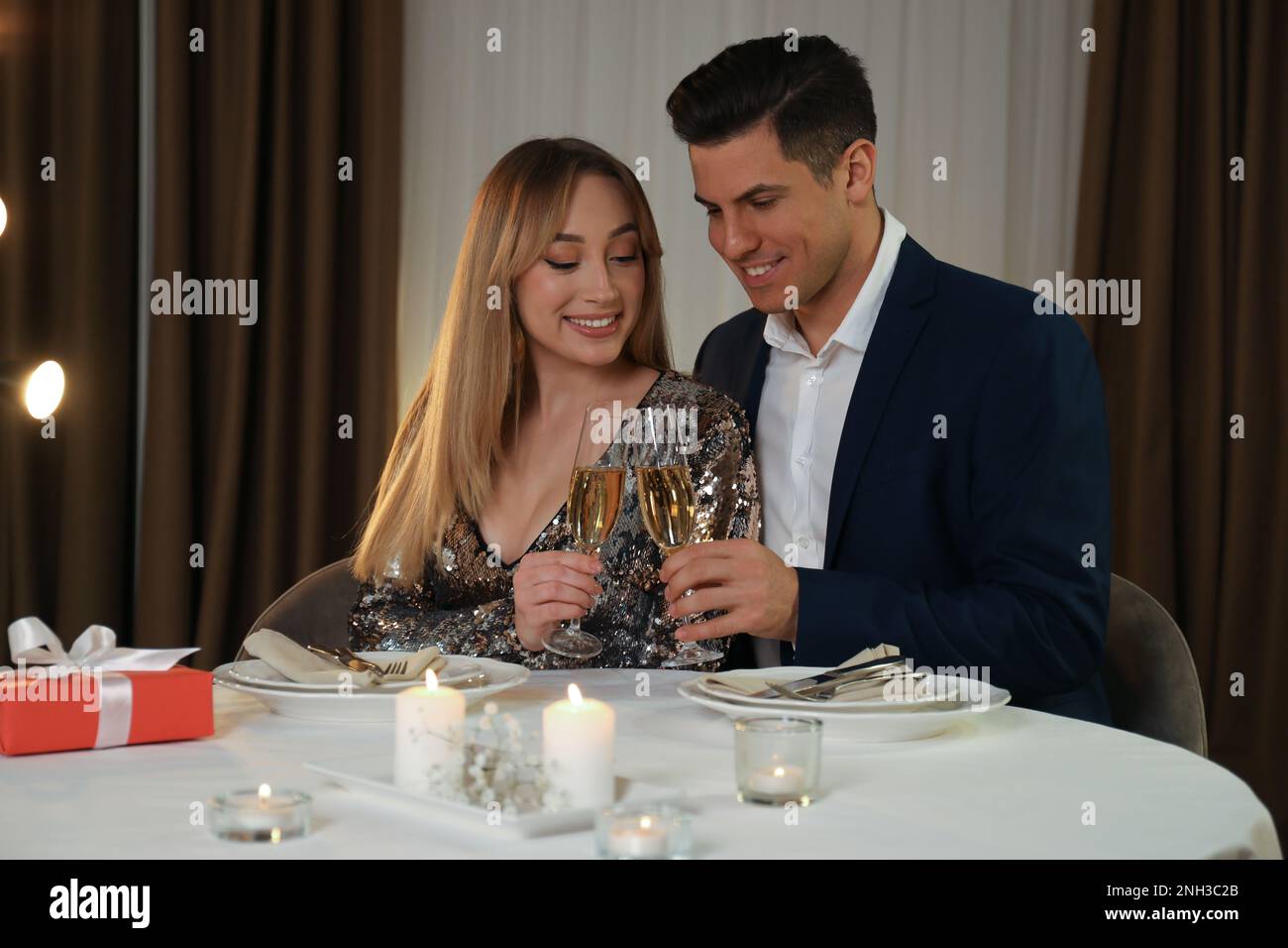 Lovely couple having romantic dinner in restaurant Stock Photo - Alamy