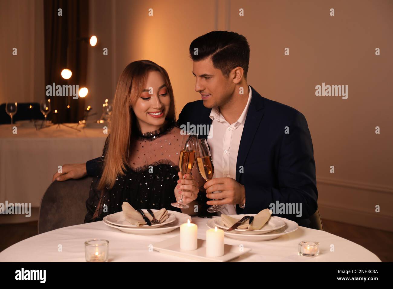 Lovely couple having romantic dinner in restaurant Stock Photo - Alamy