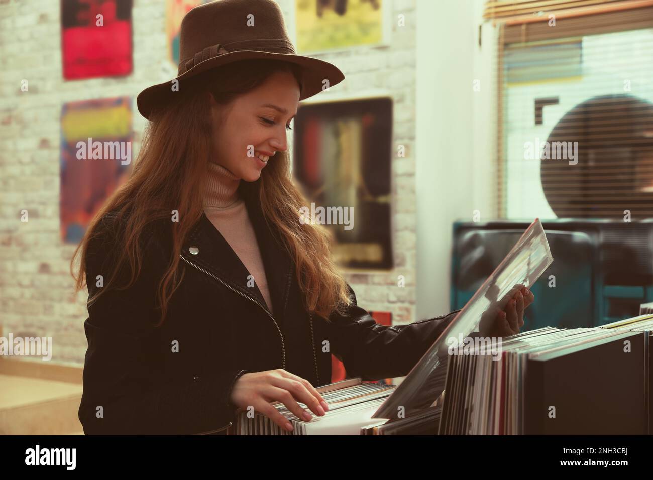 Woman in record store hi-res stock photography and images - Alamy