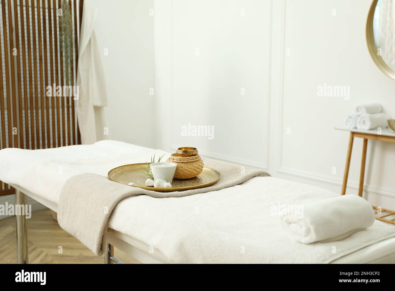 Stylish room interior with massage table in spa salon Stock Photo - Alamy