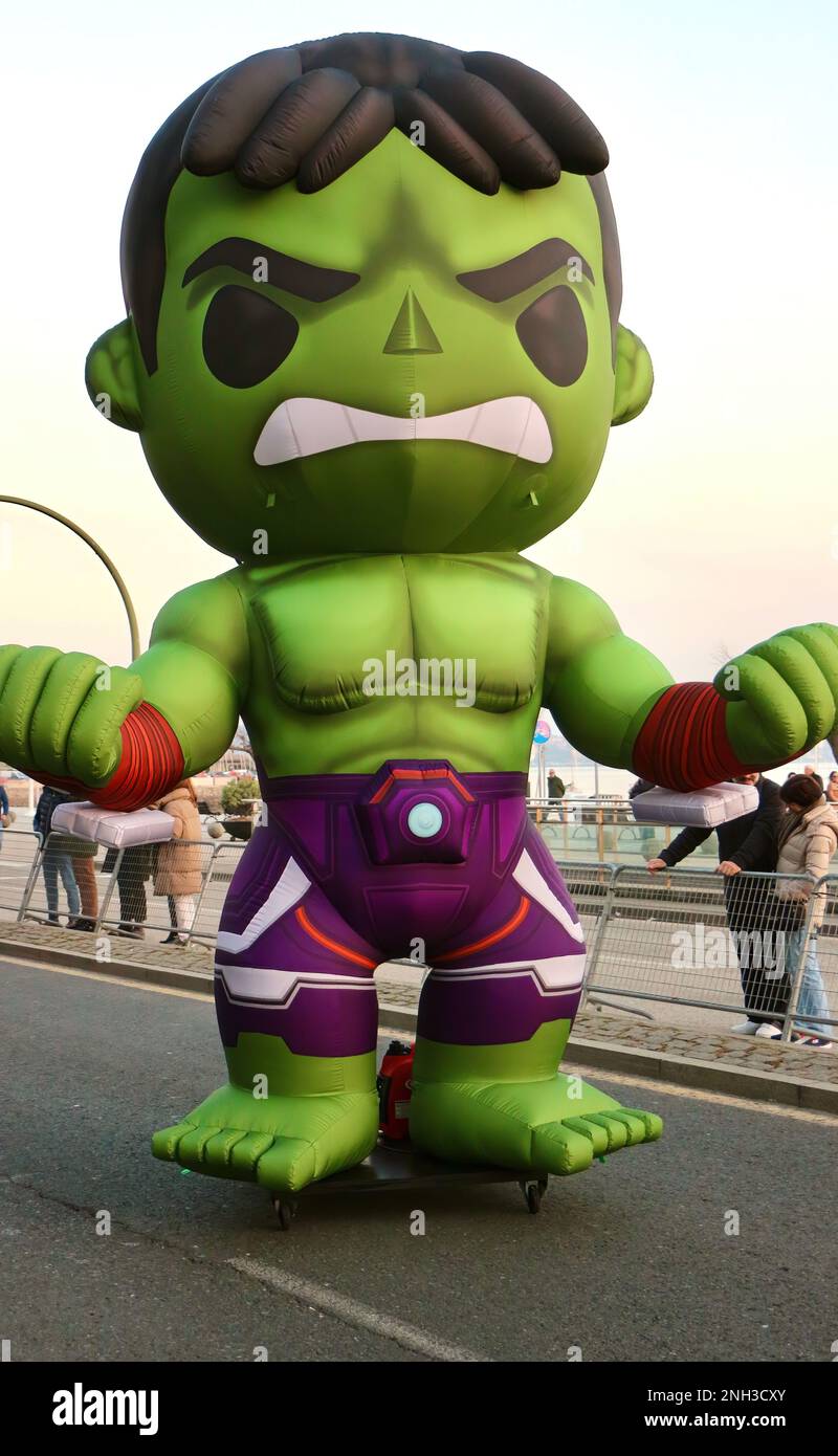 Evening carnival parade with an inflated Incredible Hulk in the Spanish ...