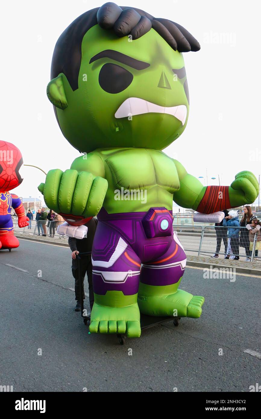 Evening carnival parade with an inflated Incredible Hulk in the Spanish ...
