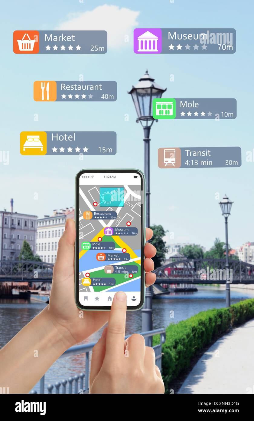 Tourist using online guide application on smartphone for navigation in ...
