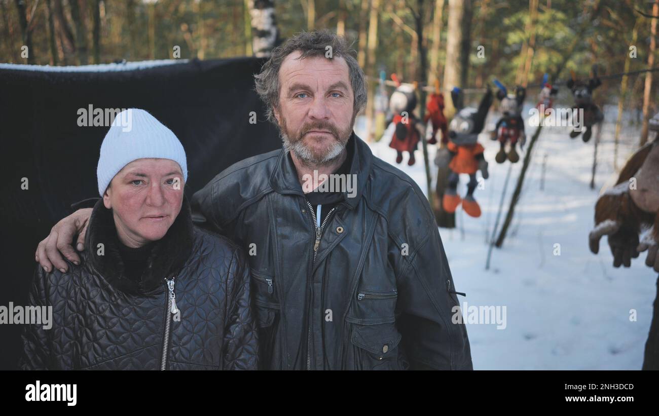 Homeless people are interviewed in the winter in the woods Stock Photo ...