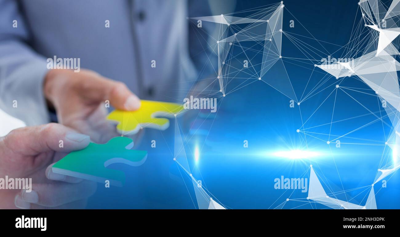 Composition of diverse business team holding puzzle pieces interface ...