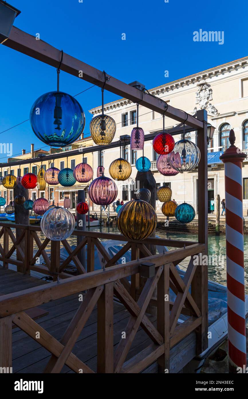 Murano glass lights with reflections hanging opposite Museo del Vetro Murano Glass Museum at ...