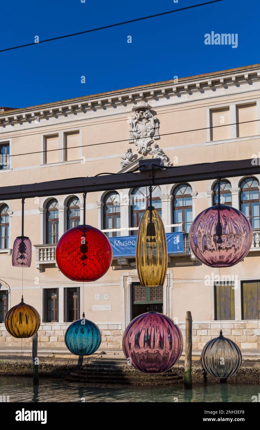 Murano glass lights with reflections hanging opposite Museo del Vetro Murano Glass Museum at ...