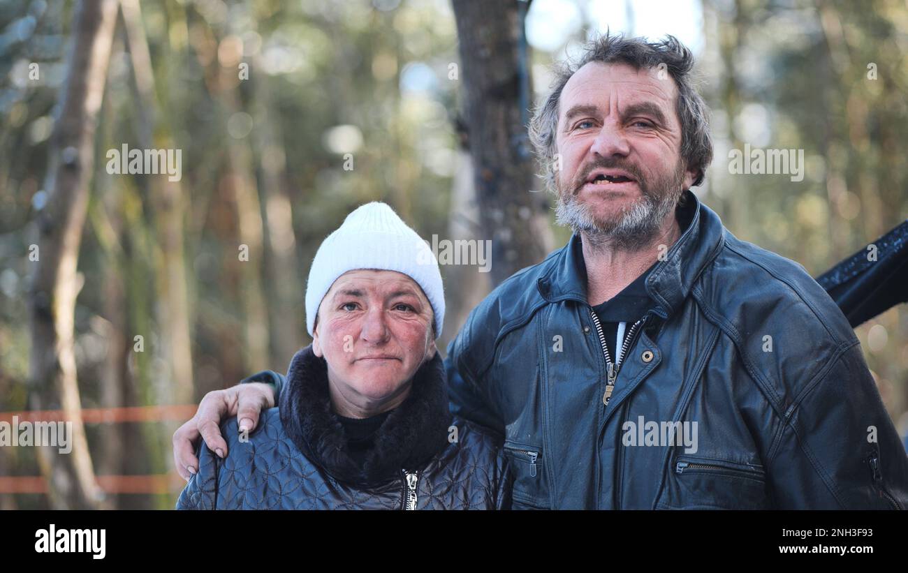 Homeless people are interviewed in the winter in the woods Stock Photo ...