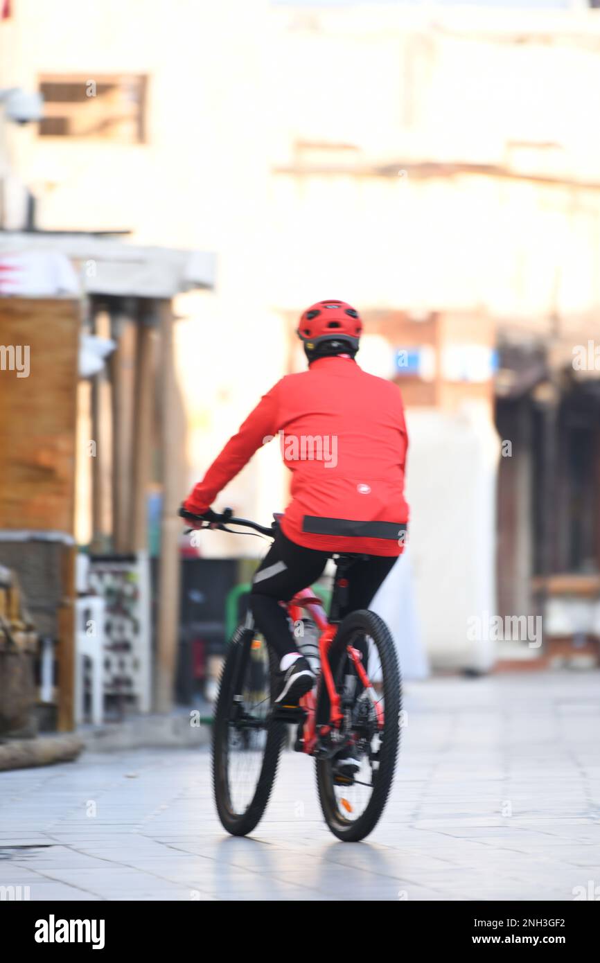 People Cycling early morning workout at corniche on Qatar Notional ...