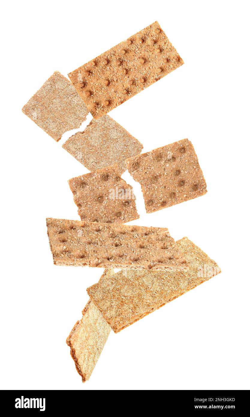 Fresh crunchy rye crispbreads falling on white background Stock Photo ...