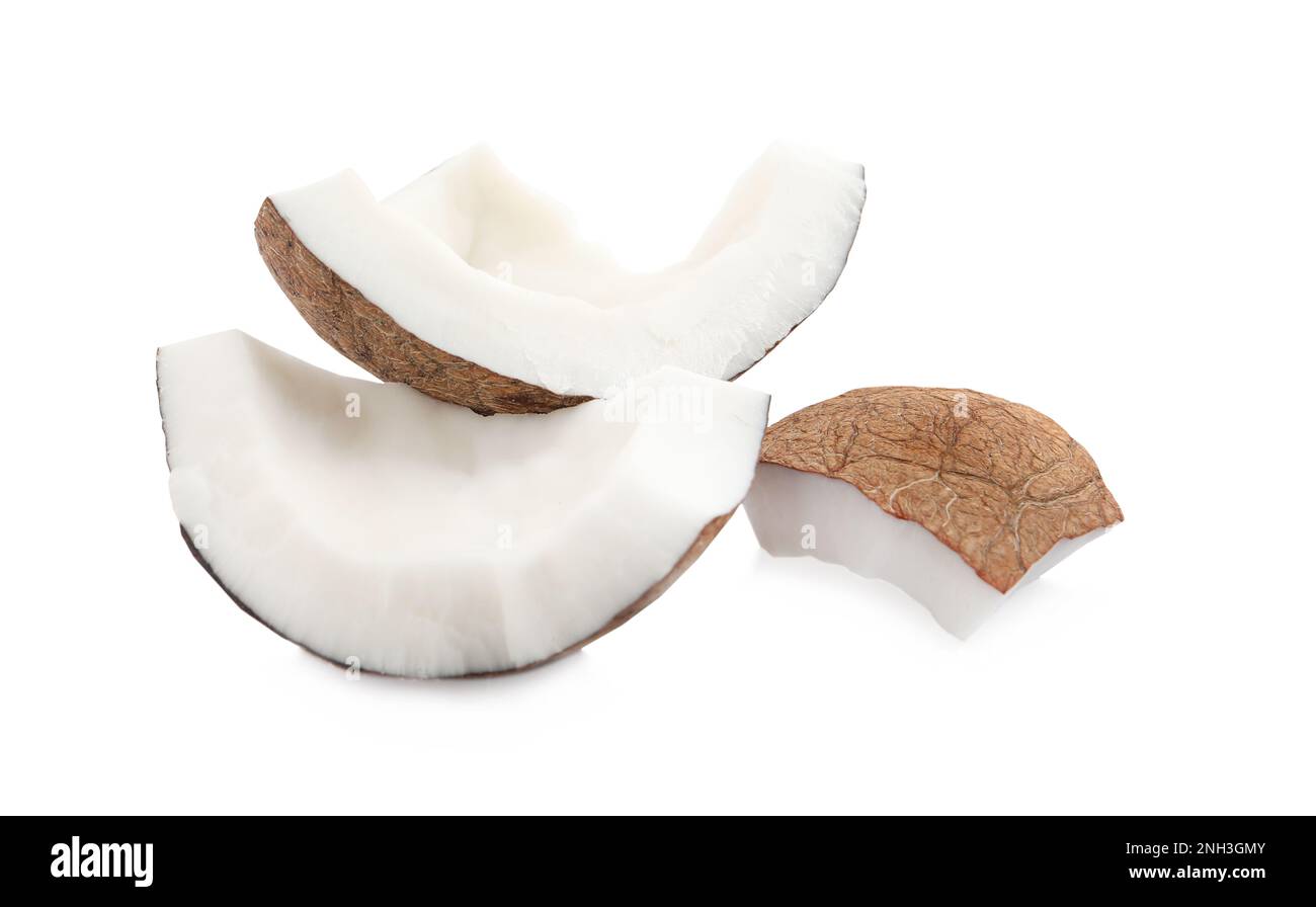 Pieces of ripe coconut on white background Stock Photo - Alamy