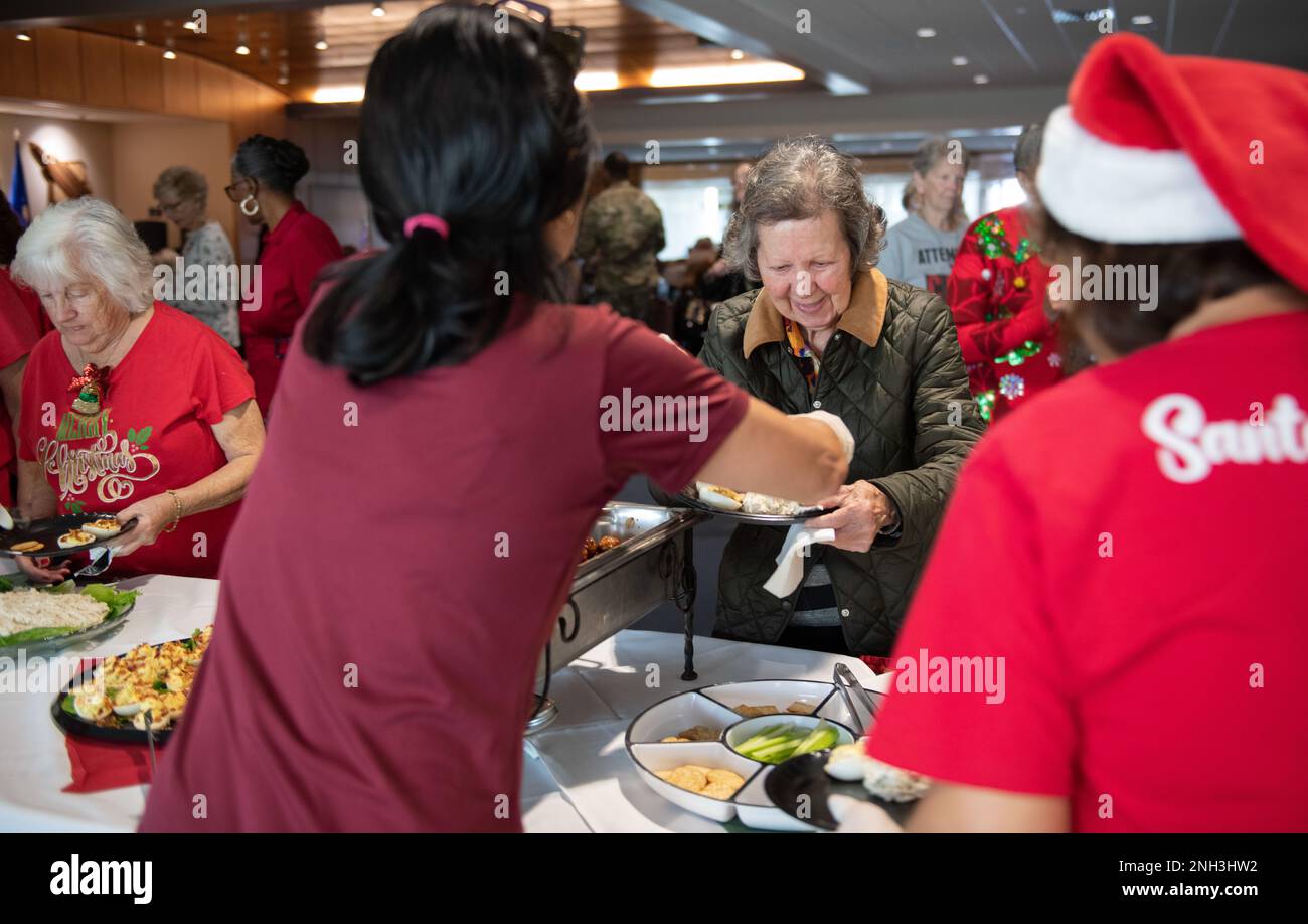 The 325th Force Support Squadron Oasis Event Center staff serves food ...