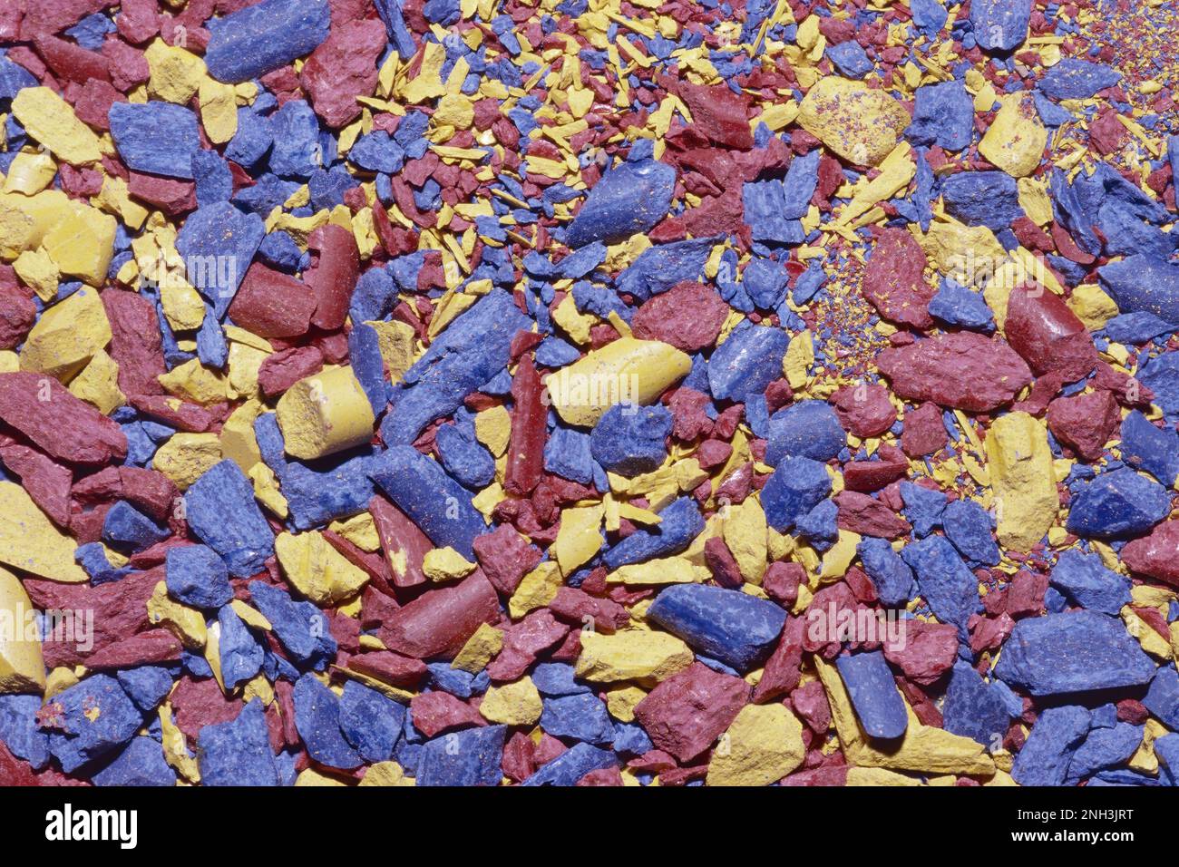 randomly arranged fragments of crayon colors in the primary colors of ...