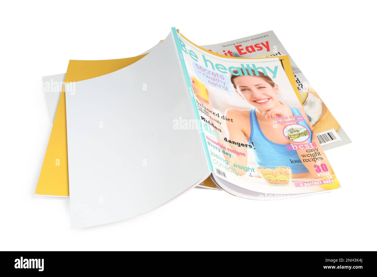 Stack of different magazines on white background Stock Photo - Alamy