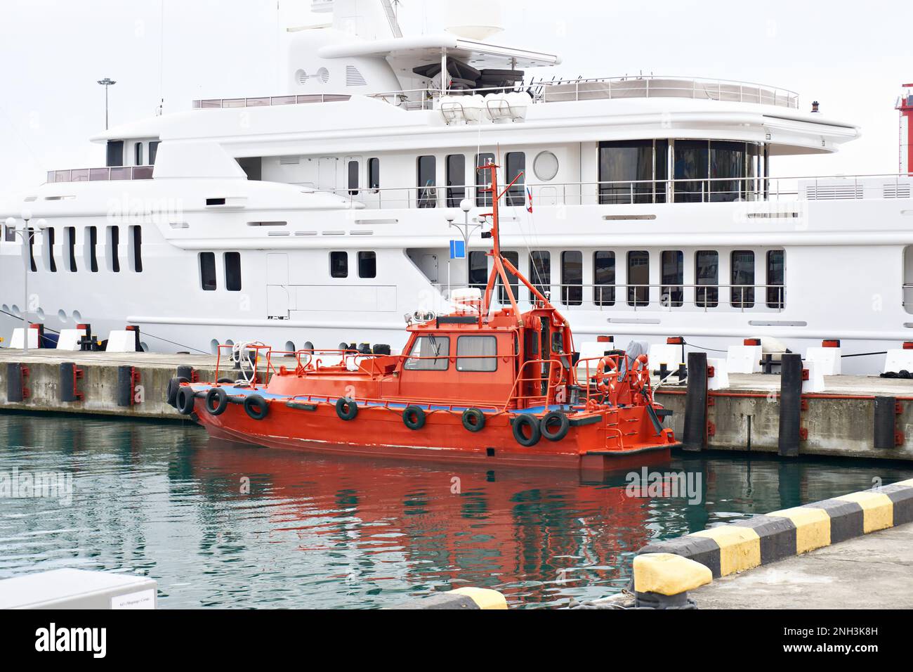 Red port boat in the parking lot Stock Photo - Alamy