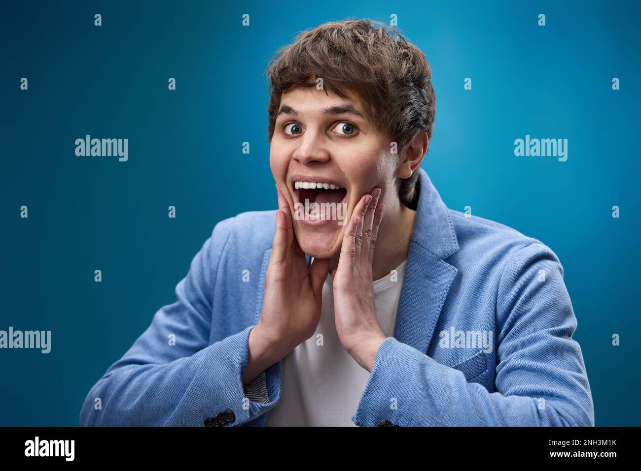 shocked man with surprise expression and excited face Stock Photo - Alamy
