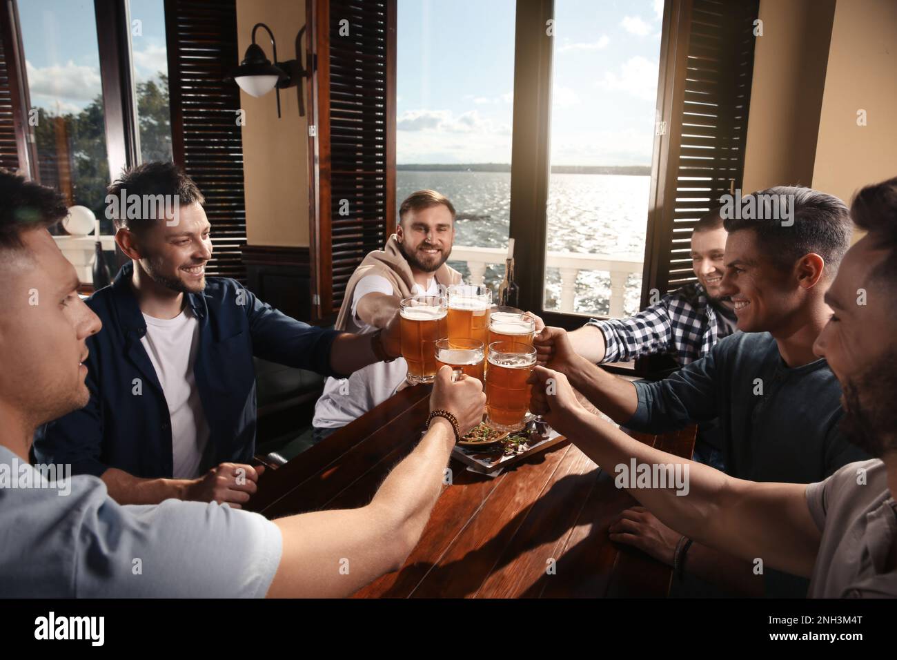 Hands holding clinking beer hi-res stock photography and images - Alamy