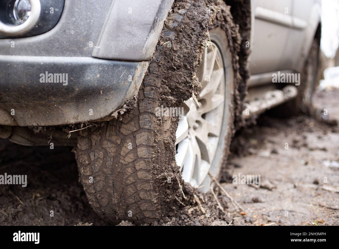 SUV wheel soiled with mud. Off-road and bad weather Stock Photo - Alamy
