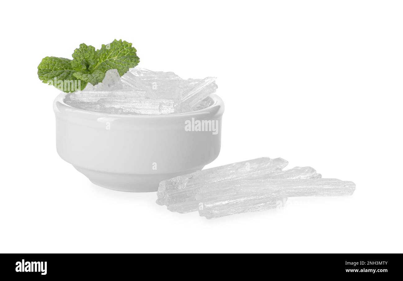 Menthol crystals and fresh mint leaves in bowl on white background ...